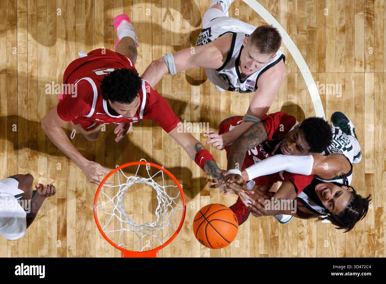 Arkansas forward Malique Ewin, left, Michigan State forward Jordan ...