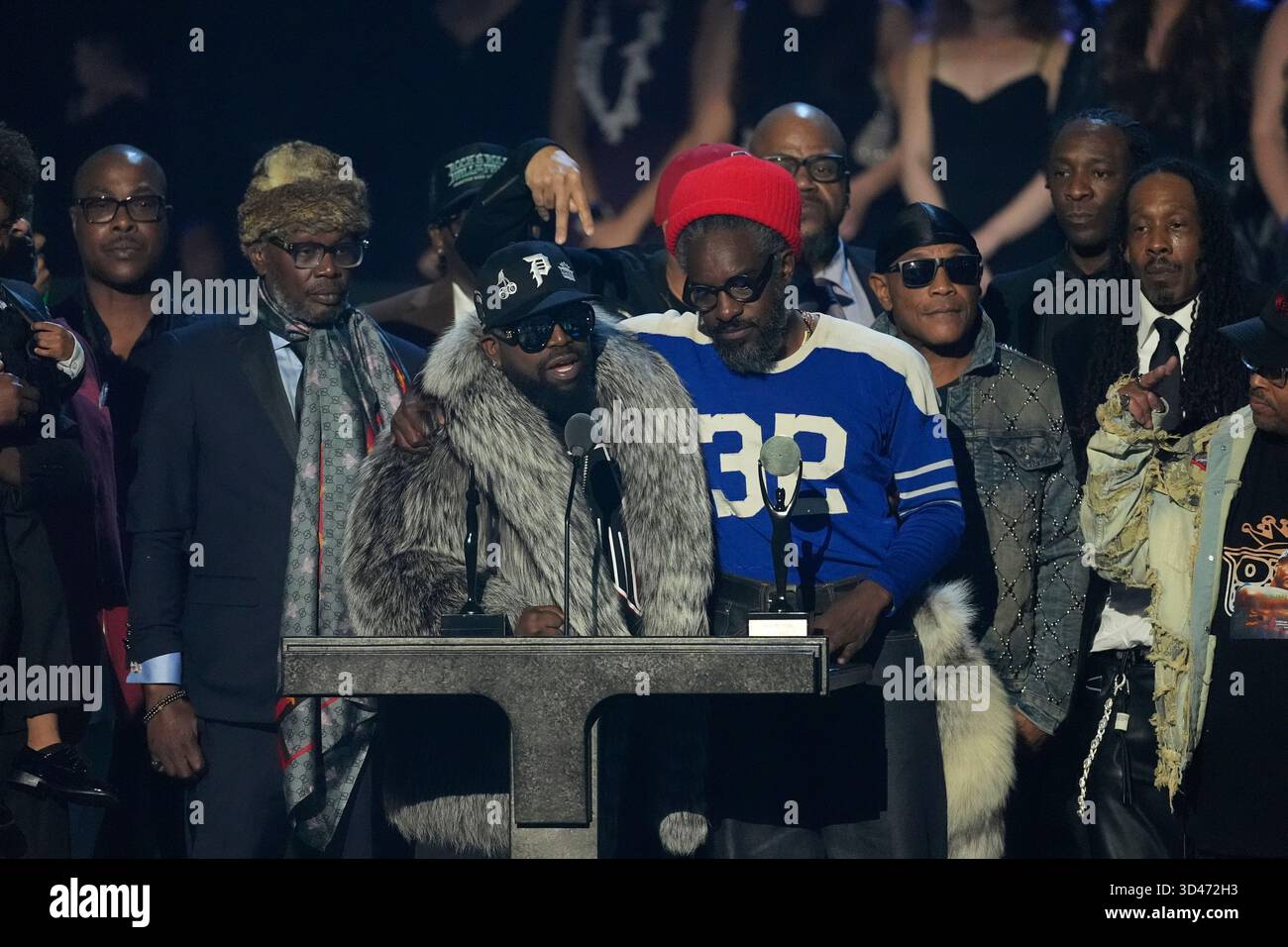 Inductees Big Boi, front left and André 3000, front right of OutKast ...