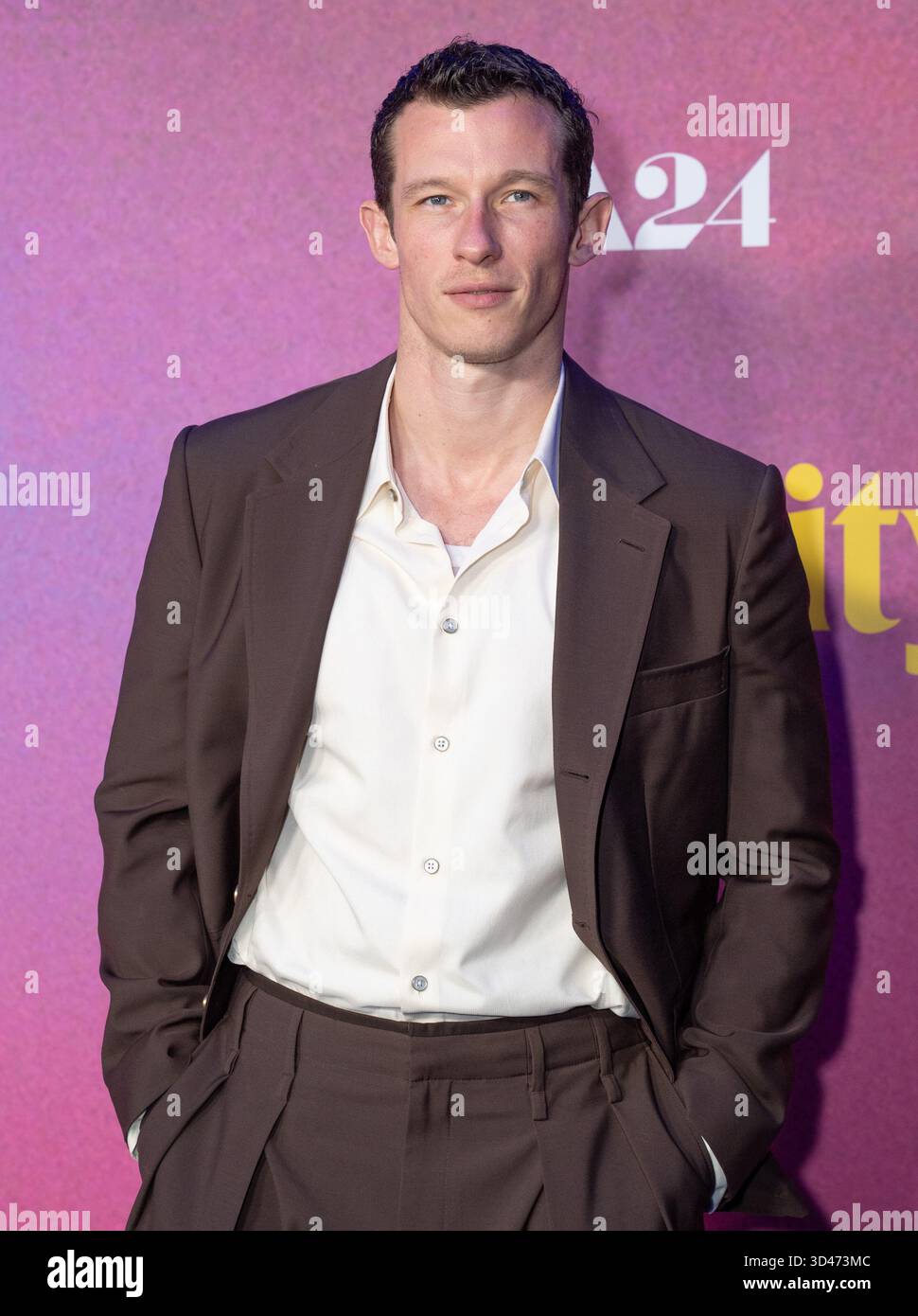 Callum Turner wearing suit by Louis Vuitton attends 'Eternity' premiere ...