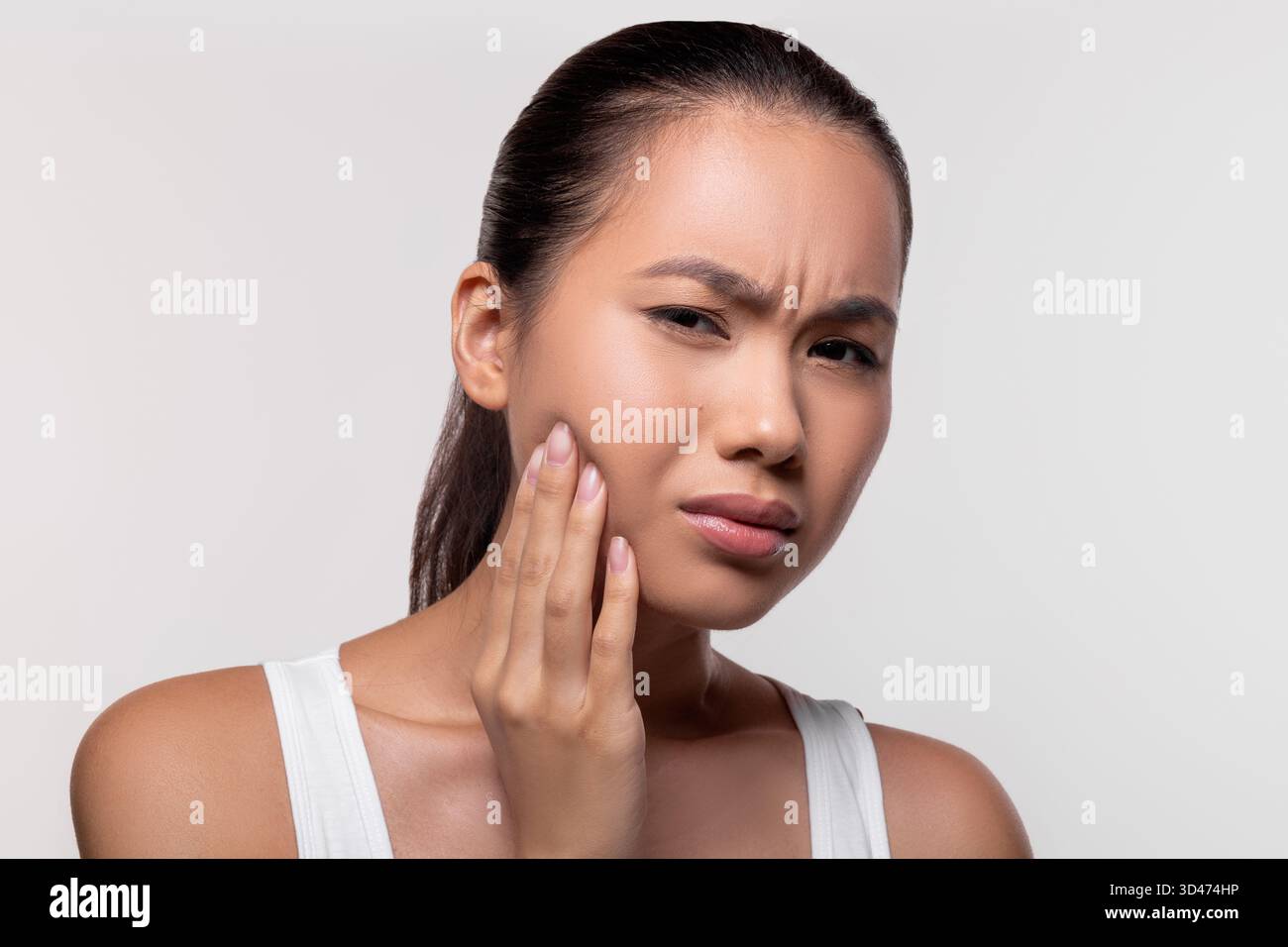 Asian Lady With Strong Wisdom Tooth Pain Holding Her Cheek in a White ...