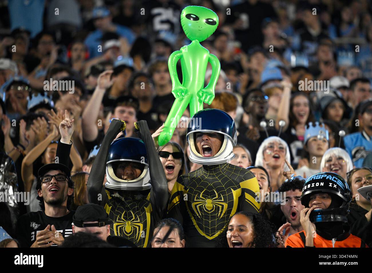 Spectators wear costumes for the Space Game theme during the first half ...