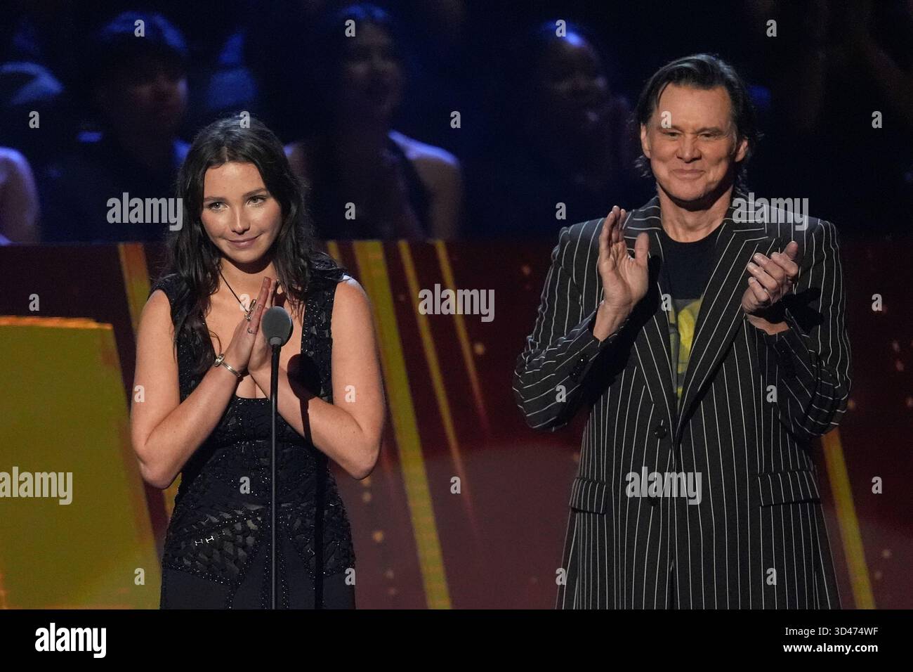 Lillian Cornell and Jim Carrey speak during the 2025 Rock and Roll Hall ...