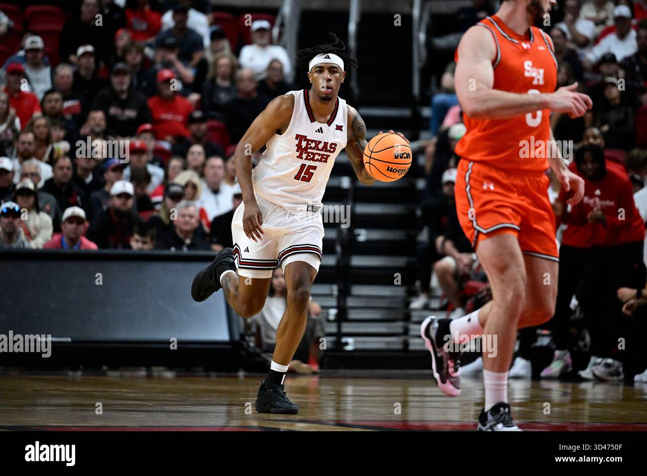 Texas Tech forward JT Toppin (15) brings the ball up court against Sam ...