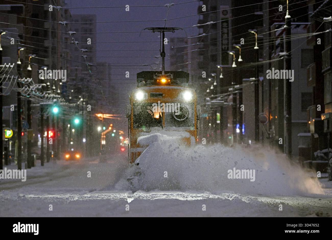 A tram snowplow, called the Sasara train, makes its first run of the ...