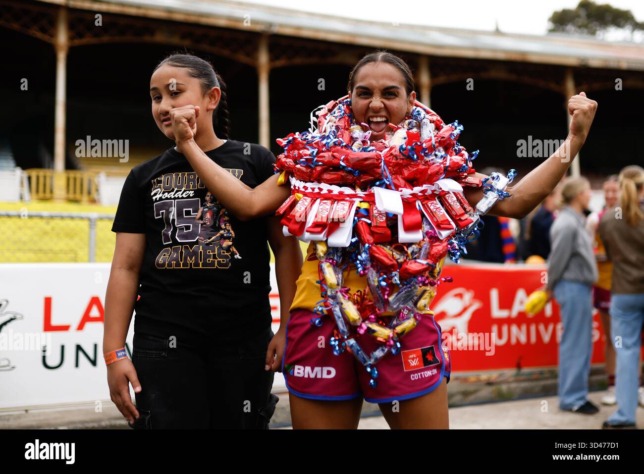 Courtney Hodder of the Lions is presented with chocolate gifts by ...
