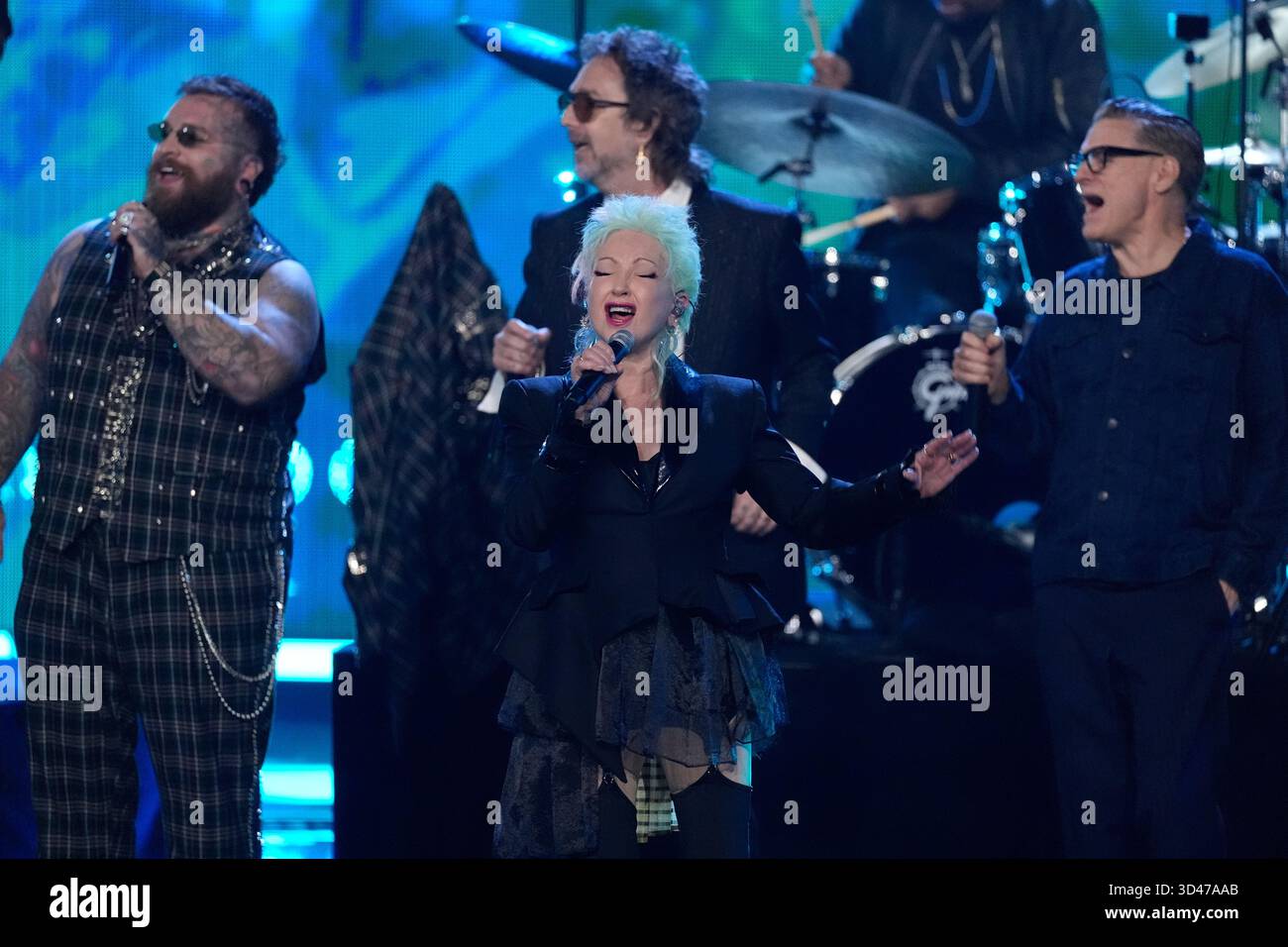Teddy Swims, from left, Cyndi Lauper and Bryan Adams perform during the ...