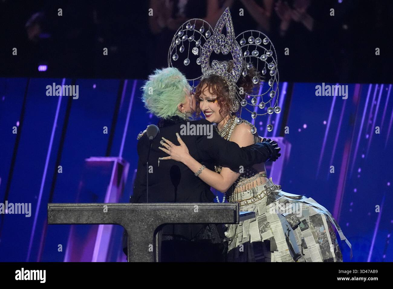 Cyndi Lauper, left and Chappell Roan react during the 2025 Rock and ...