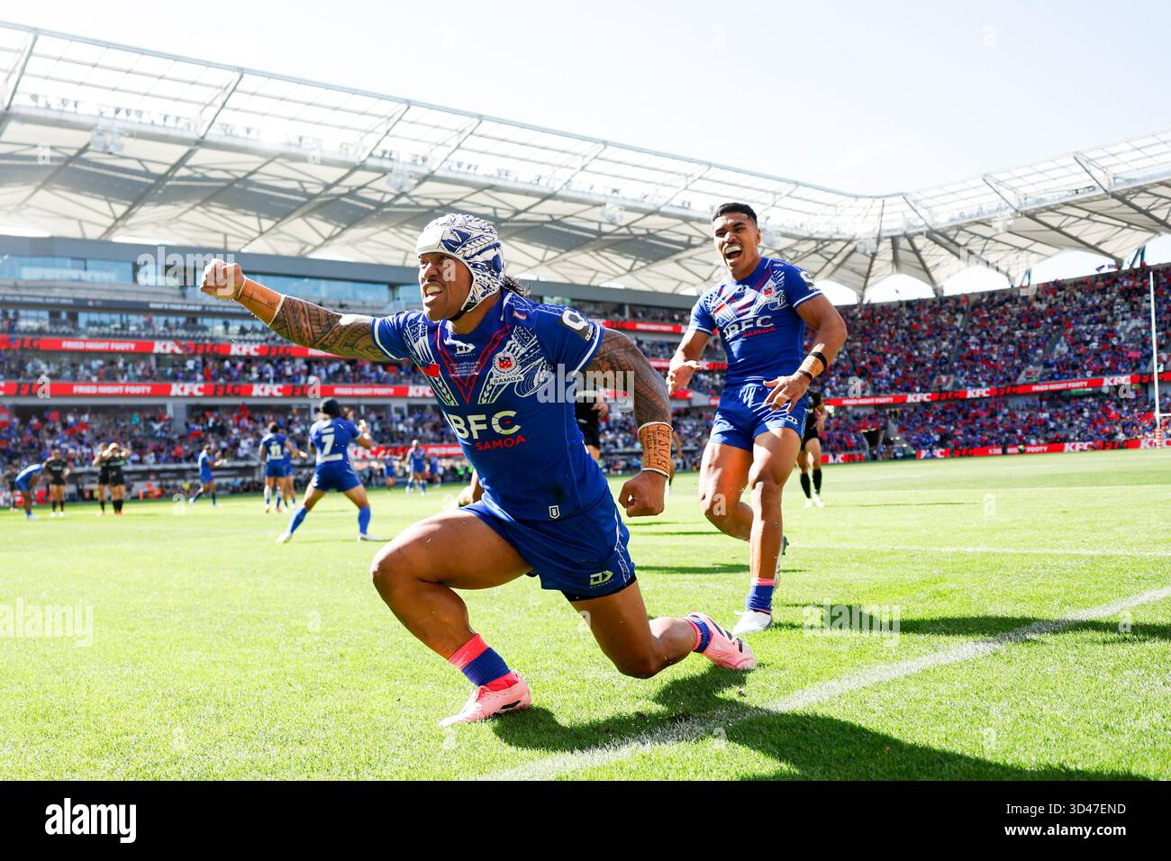 Brian To’o of Toa Samoa celebrates scoring a try with team mates during ...