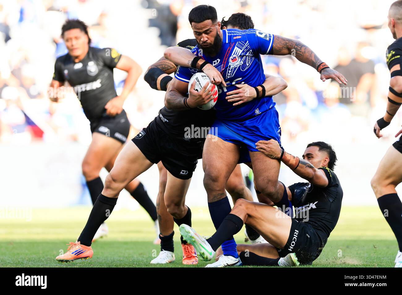 Payne Haas of Toa Samoa is tackled during the rugby league Pacific Cup ...