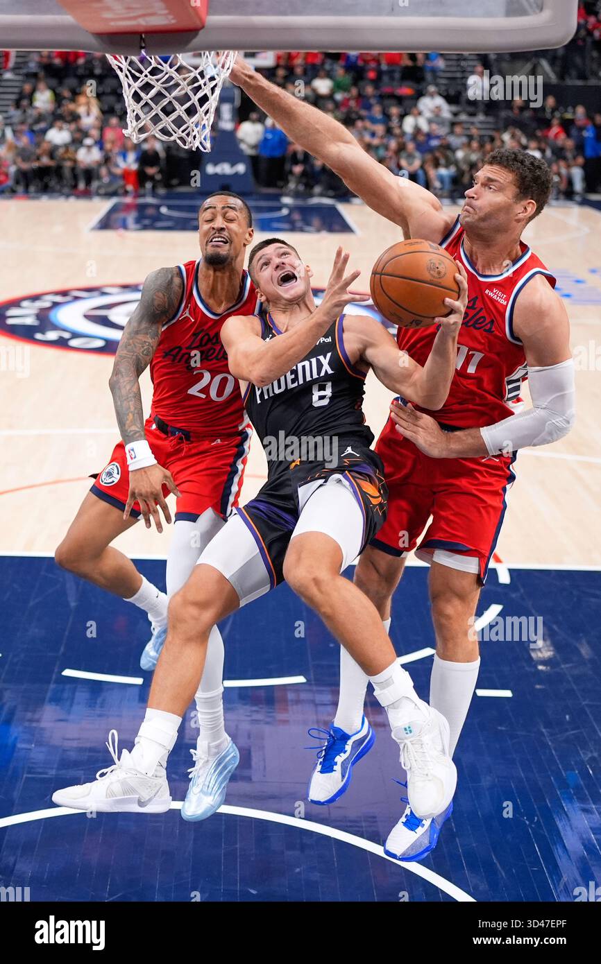 Phoenix Suns guard Grayson Allen, center, shoots as Los Angeles ...