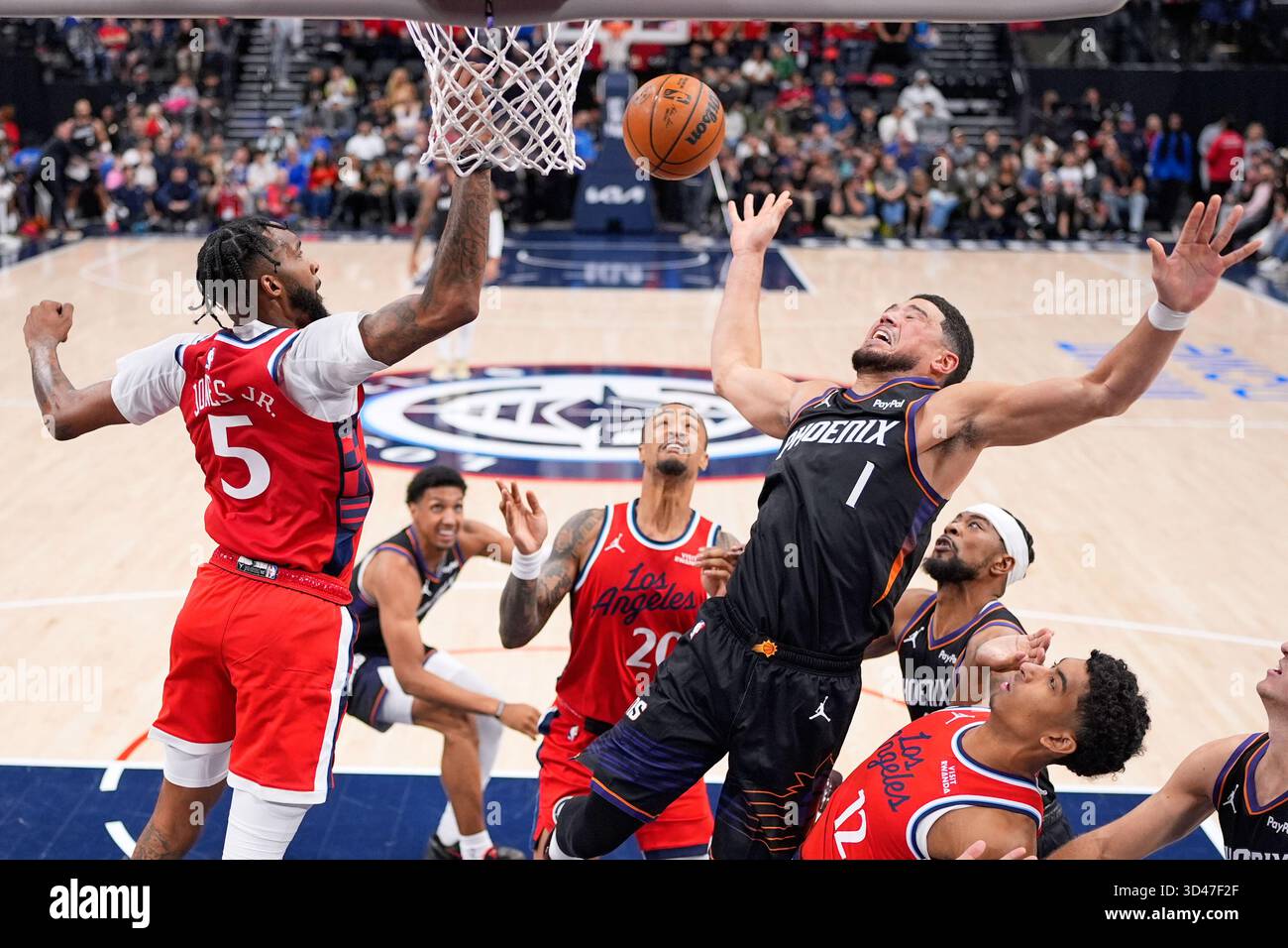 Phoenix Suns guard Devin Booker (1) and Los Angeles Clippers forward ...