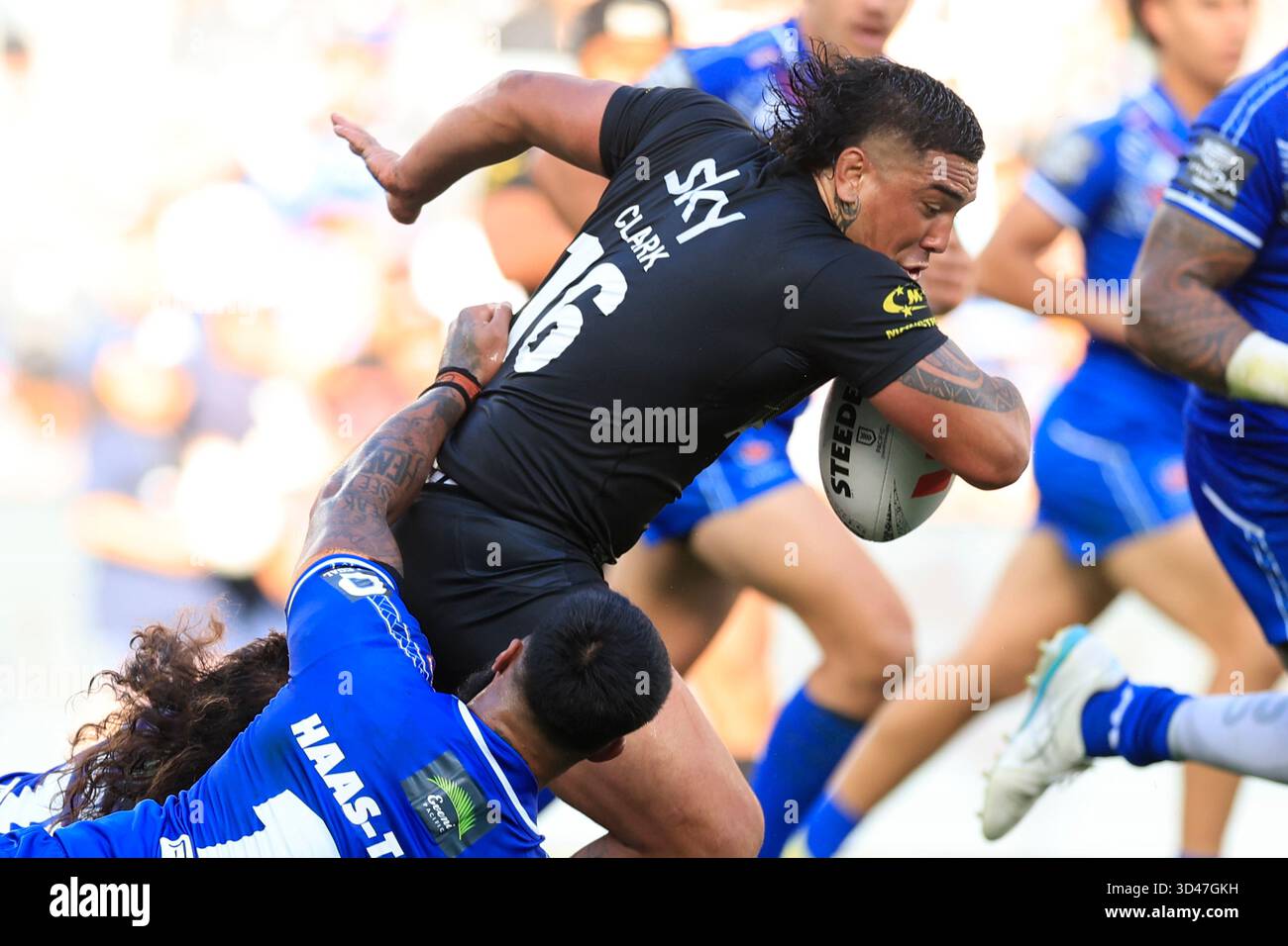 Erin Clark of the Kiwis on his way to scoring a try during the rugby league Pacific Cup Men’s ...