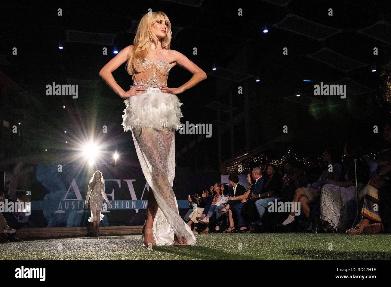 November 8, 2025: Austin Fashion Week models in action during nighttime ...