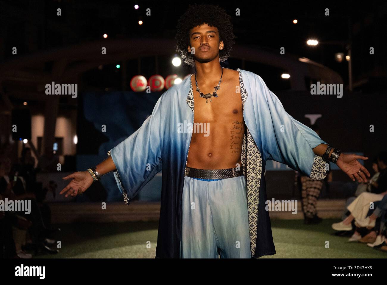 November 8, 2025: Austin Fashion Week models in action during nighttime ...