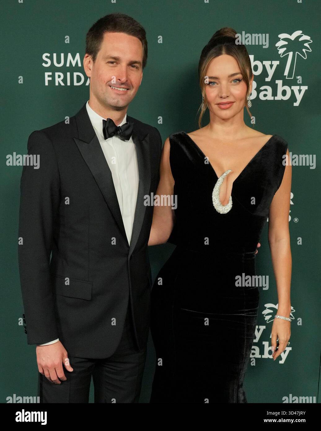 Evan Spiegel, left, and Miranda Kerr arrive at the 2025 Baby2Baby gala ...