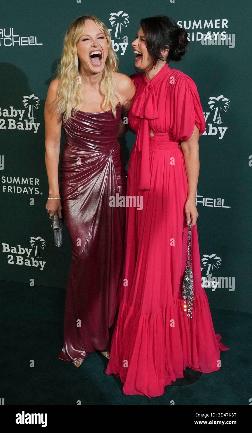 Malin Akerman, left, and Katie Lowes arrive at the 2025 Baby2Baby gala ...