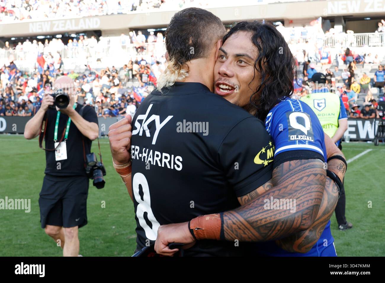 James Fisher-Harris of the Kiwis and Jarome Luai of Toa Samoa hug after ...