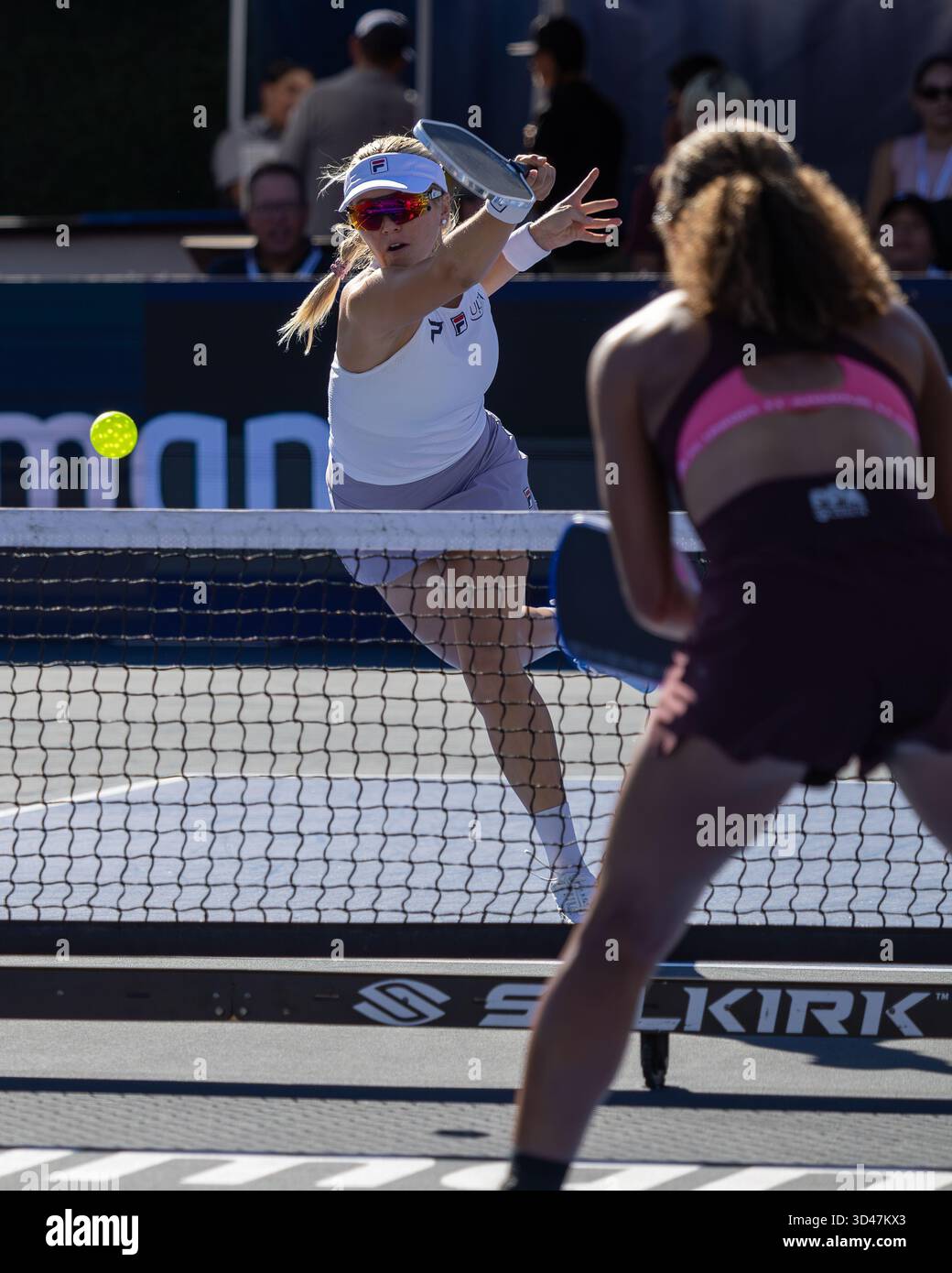 Anna Leigh Waters returns the ball during the Mixed Doubles Final at ...