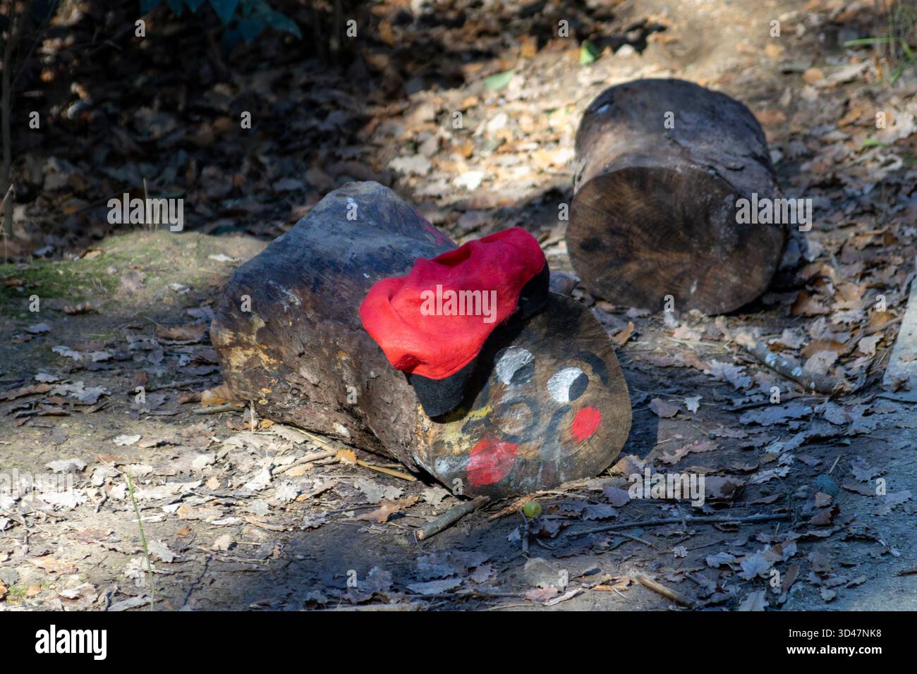 Tio de nadal log with a painted face and a traditional red barretina ...