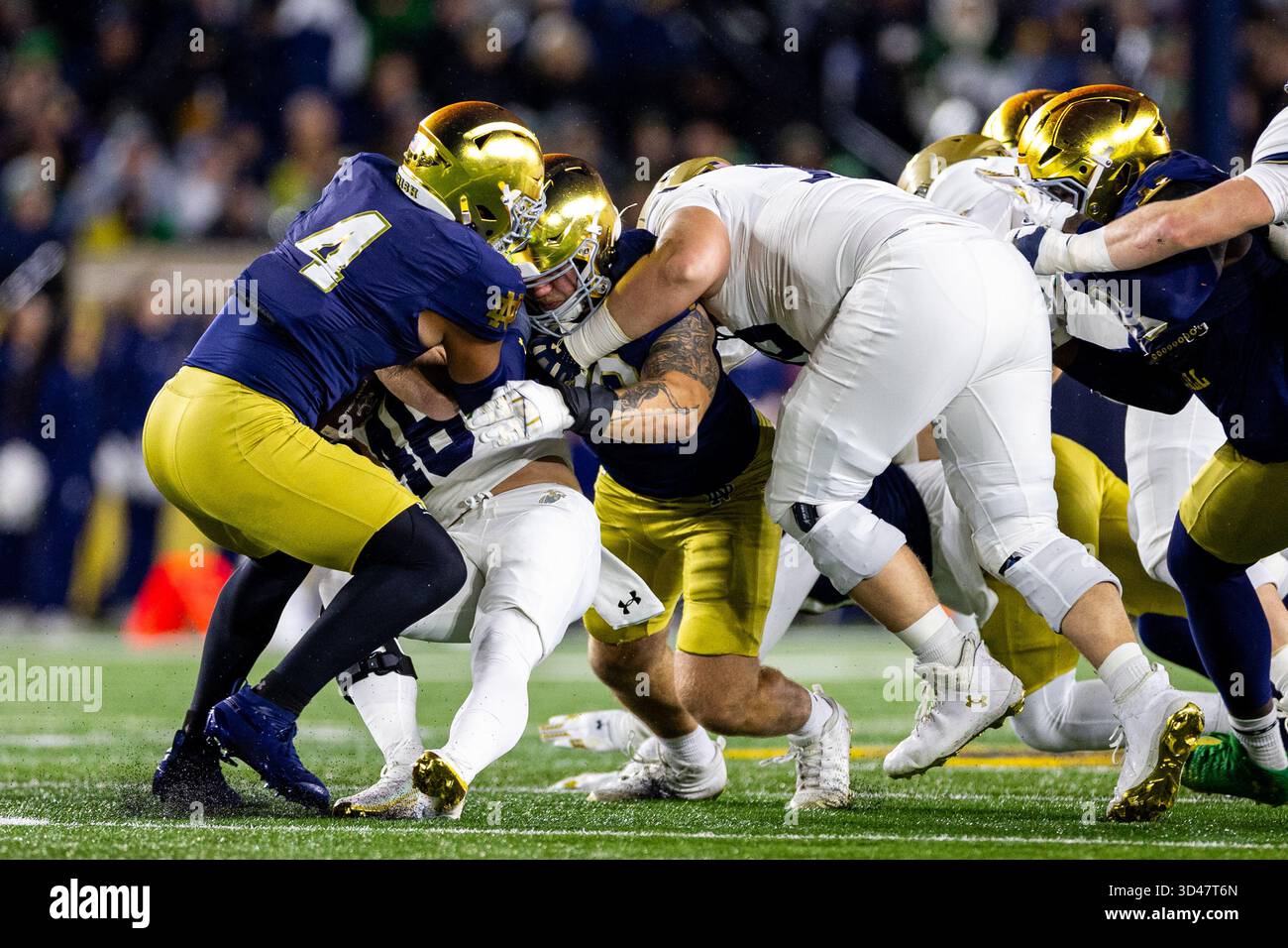 November 08, 2025: Notre Dame defenders make the tackle on Navy running ...
