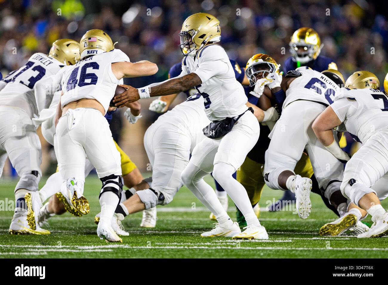 November 08, 2025: Navy quarterback Braxton Woodson (5) hands the ball ...
