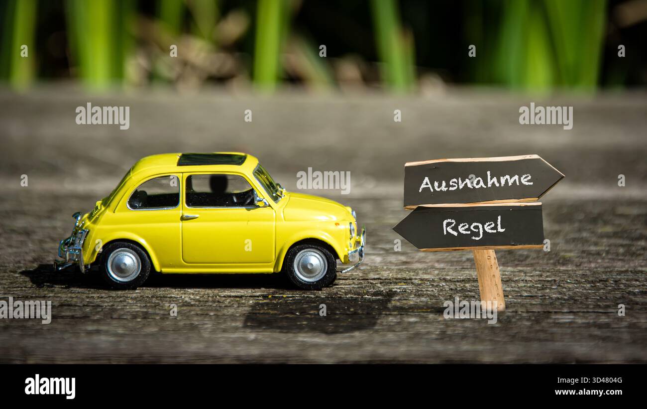 An image with a signpost pointing in two different directions in German ...