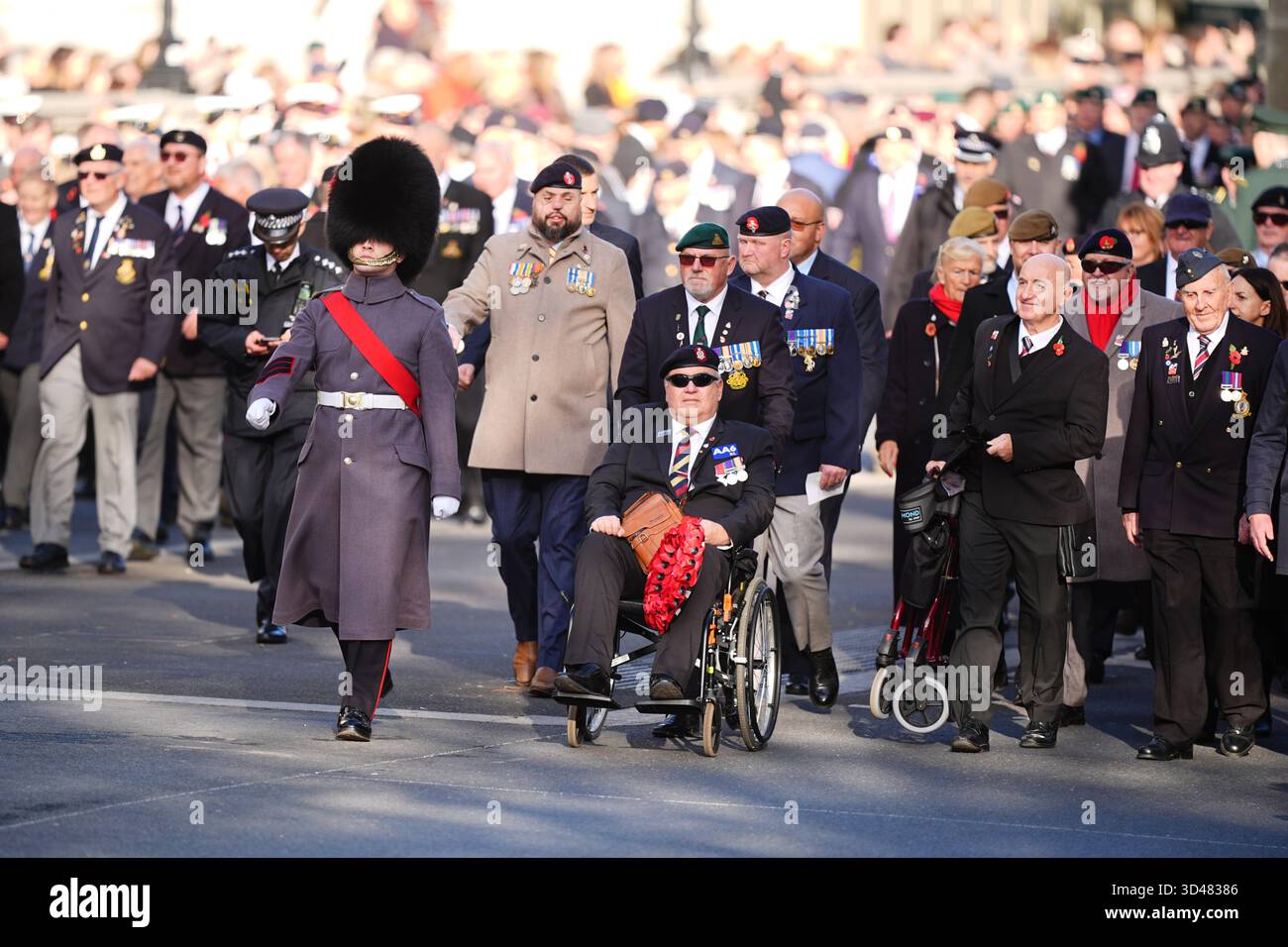 D-Day veteran Bernard Morgan (far right) marches in to position with ...