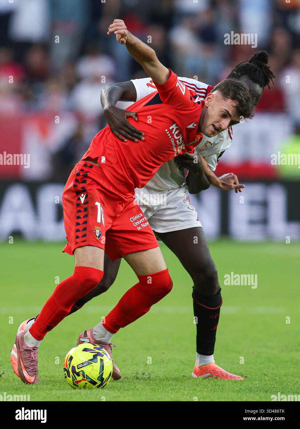 Aimar Oroz of CA Osasuna and Batista Mendy of Sevilla FC during the La ...