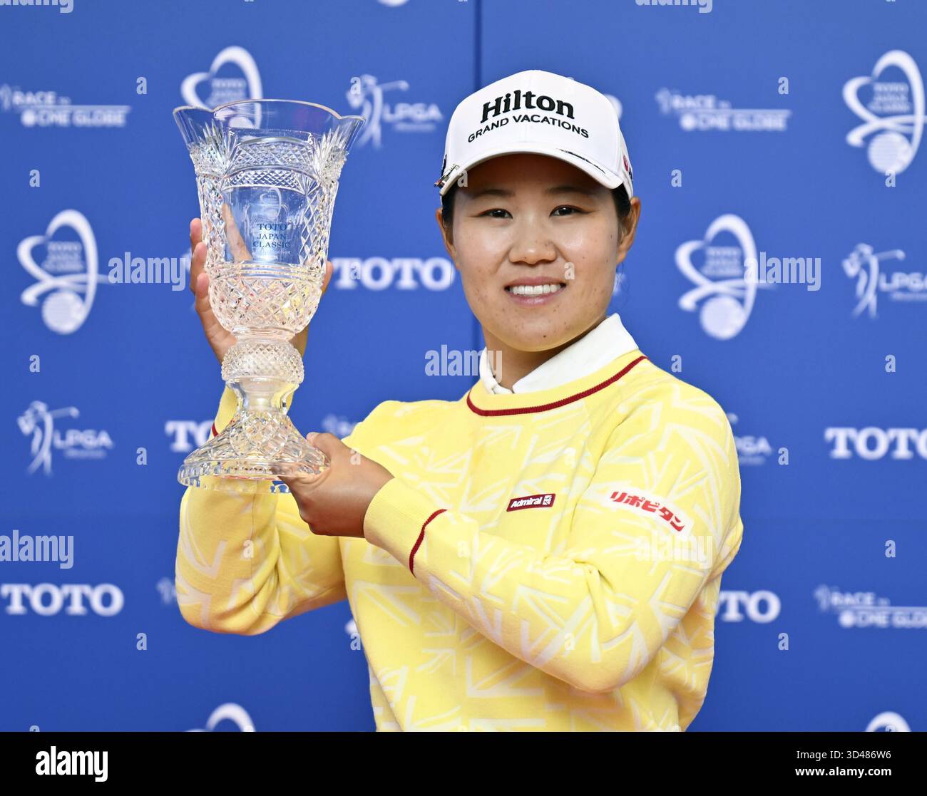 Japan's Nasa Hataoka poses with the victor's trophy after winning the ...