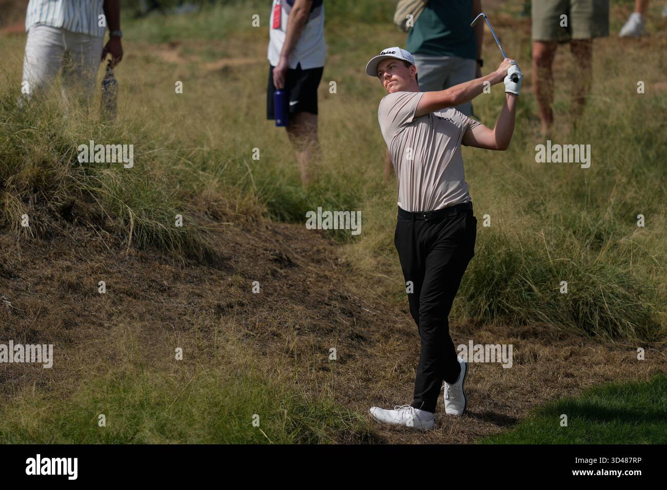 Daniel Hillier of New Zealand plays his second shot on the 7th hole ...