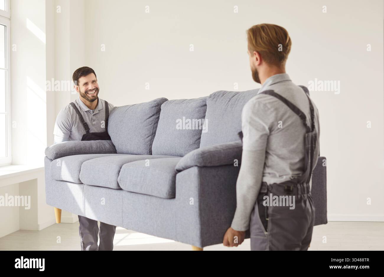 Two men moving large delivery hi-res stock photography and images - Alamy