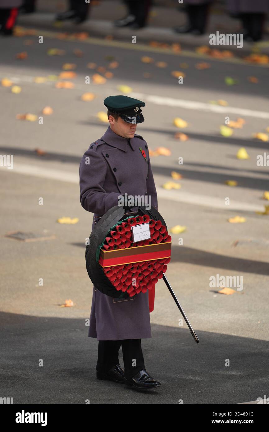 Major Ollie Plunket, The Rifles, Equerry to Queen Camilla lays a wreath ...