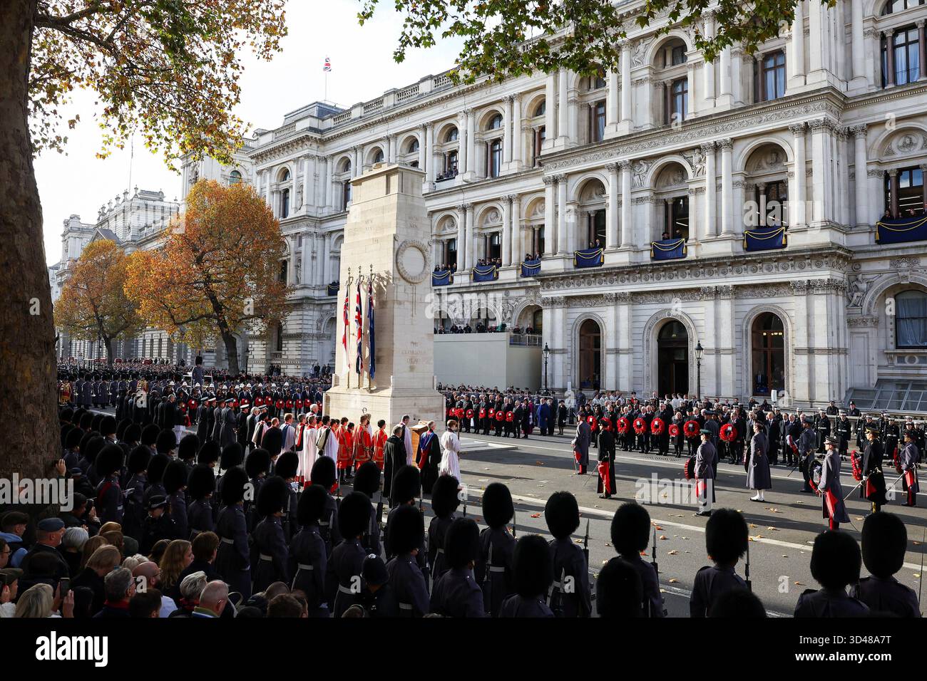 People attend the Remembrance Sunday ceremony at the Cenotaph on ...