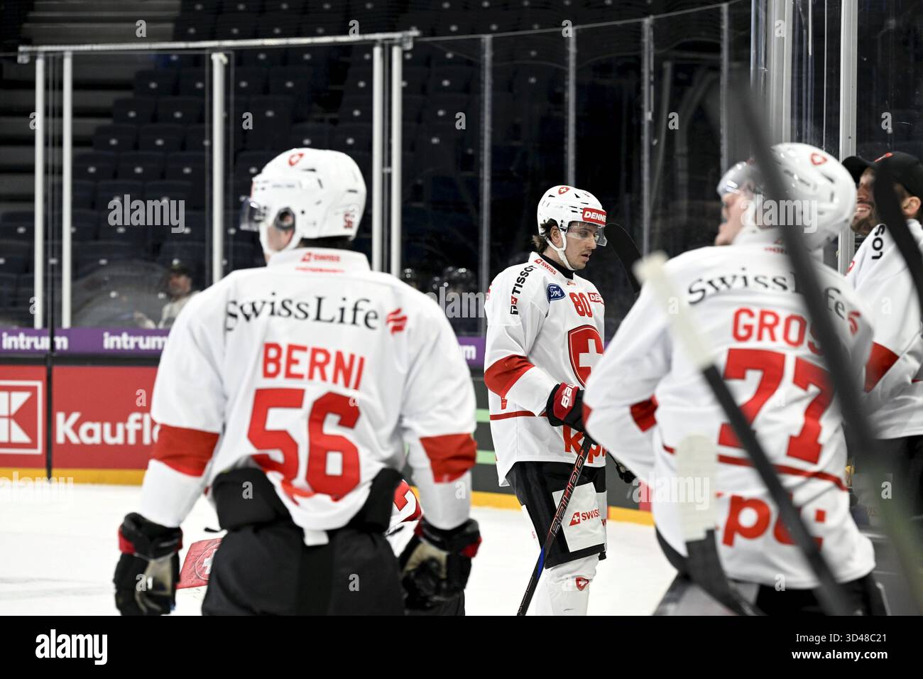 Nicolas Baechler (C) of Team Switzerland leaves the ice after major ...
