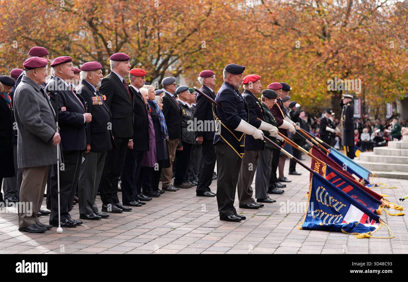 Standards are lowered during a two minute silence during a Remembrance ...
