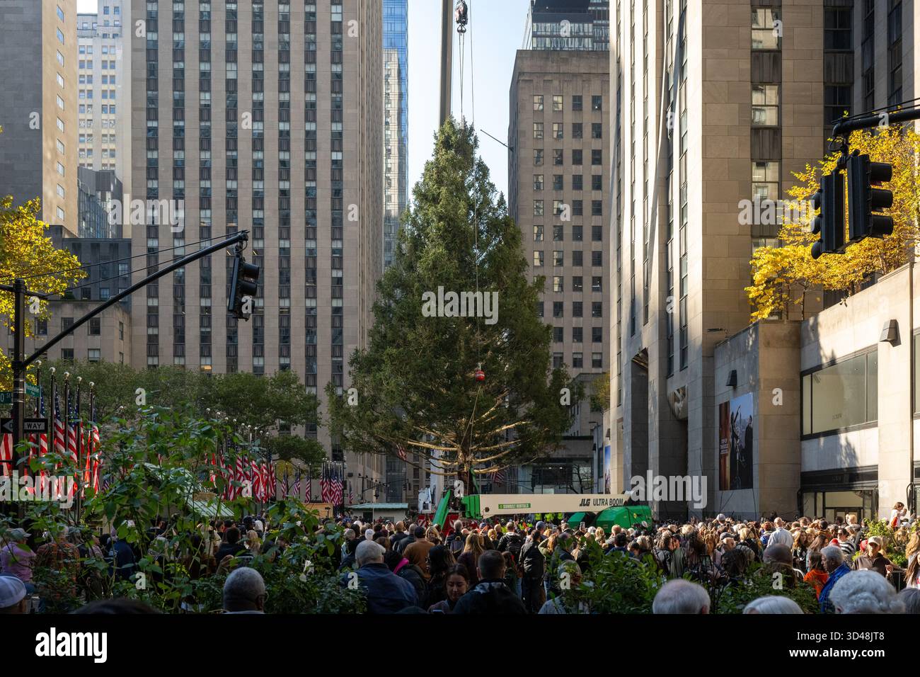 Workers install the Rockefeller Center Christmas Tree after its arrival ...