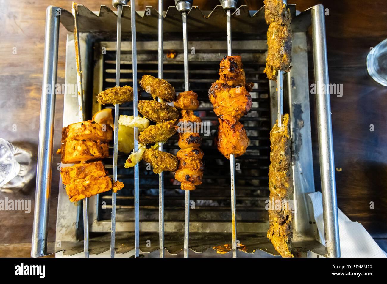 Indian barbecue grill with assorted tandoori and seekh kebabs Stock ...