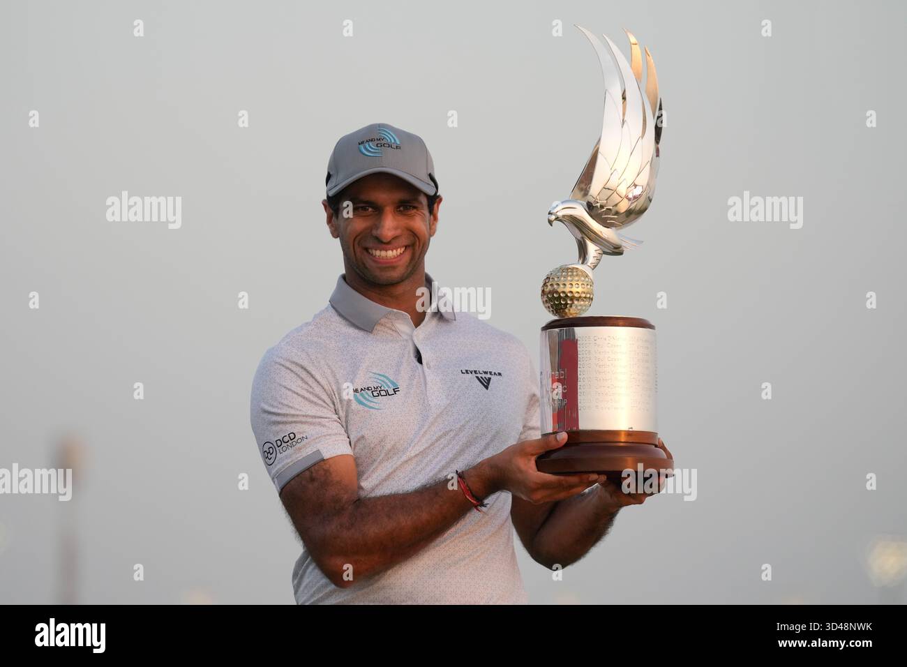 Aaron Rai of England poses with the trophy after winning the Abu Dhabi ...