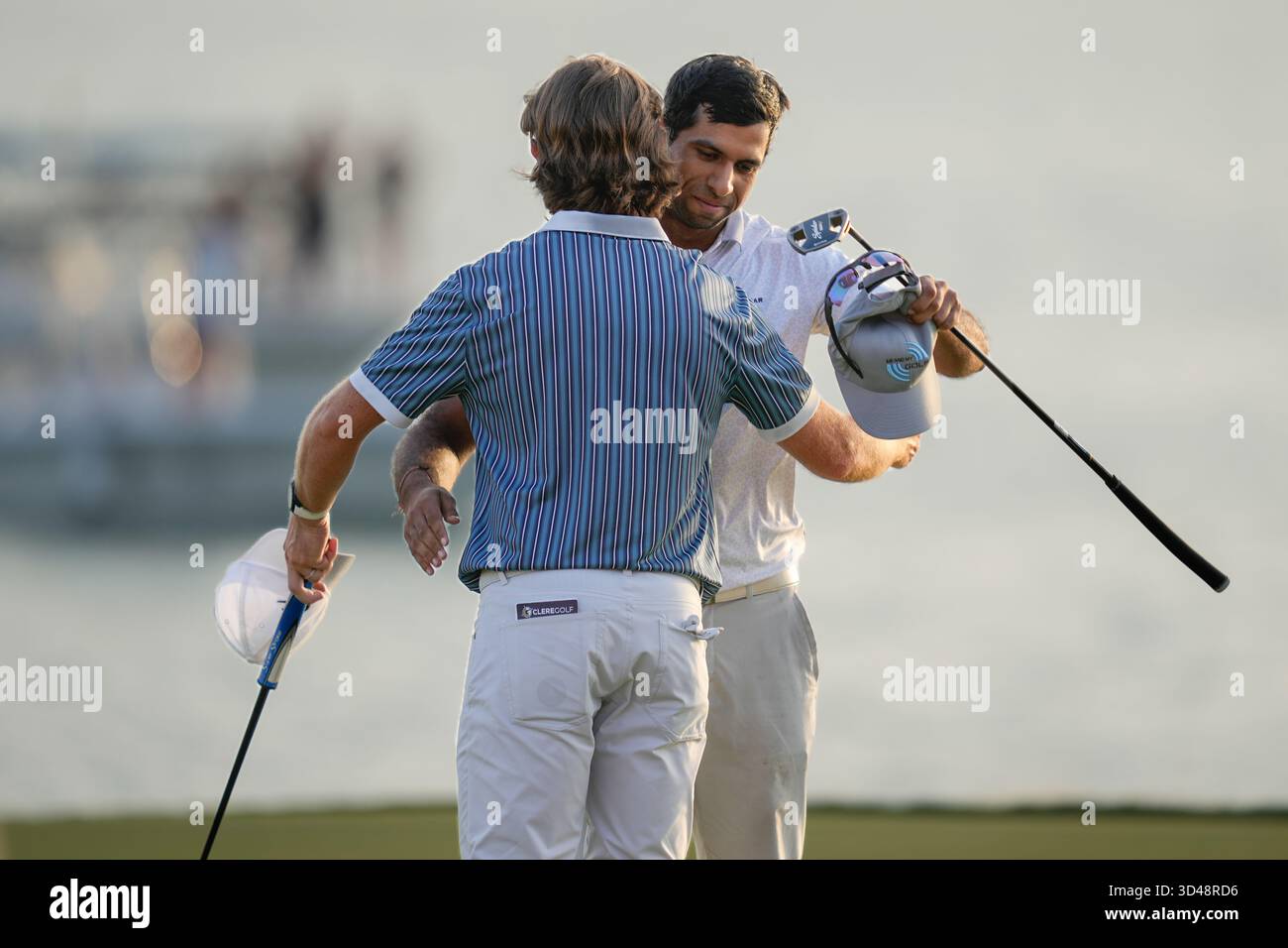 Tommy Fleetwood of England, left, hugs Aaron Rai of England after Rai ...