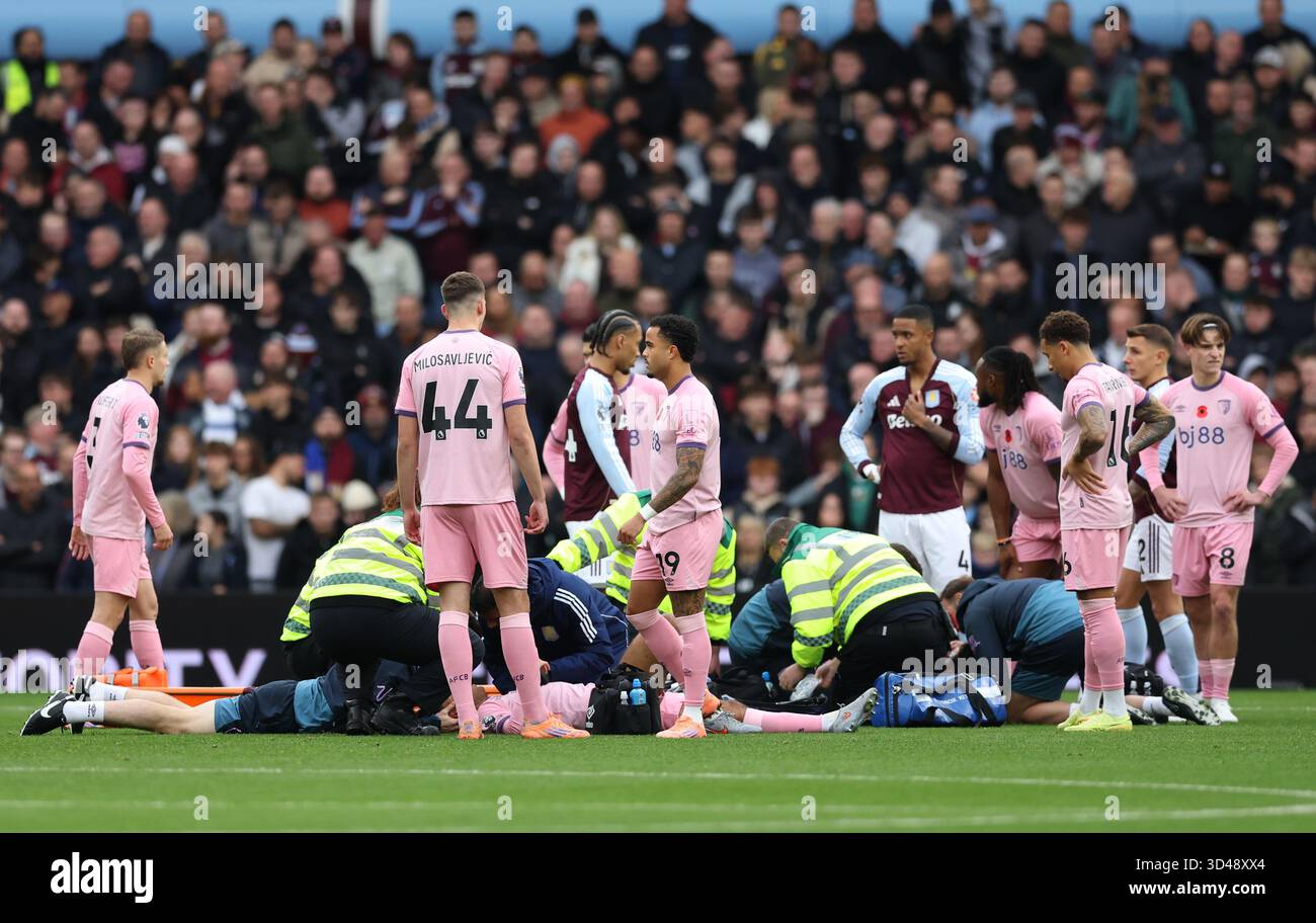 Bournemouth's Tyler Adams and Adam Smith receive treatment after a ...