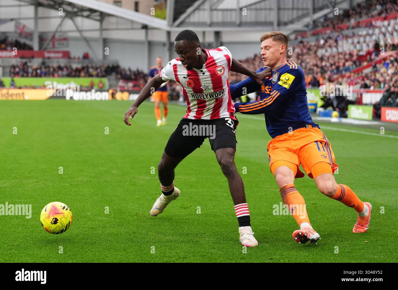 Brentford's Michael Kayode (left) and Newcastle United's Harvey Barnes ...