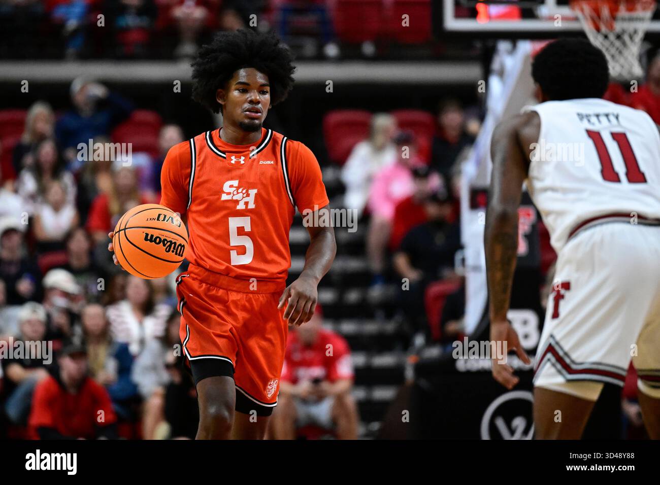 Sam Houston State guard Justin Begg (5) brings the ball up court ...