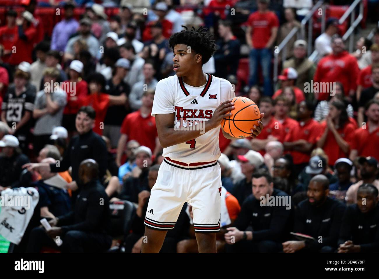 Texas Tech guard Christian Anderson (4) controls the ball against Sam ...