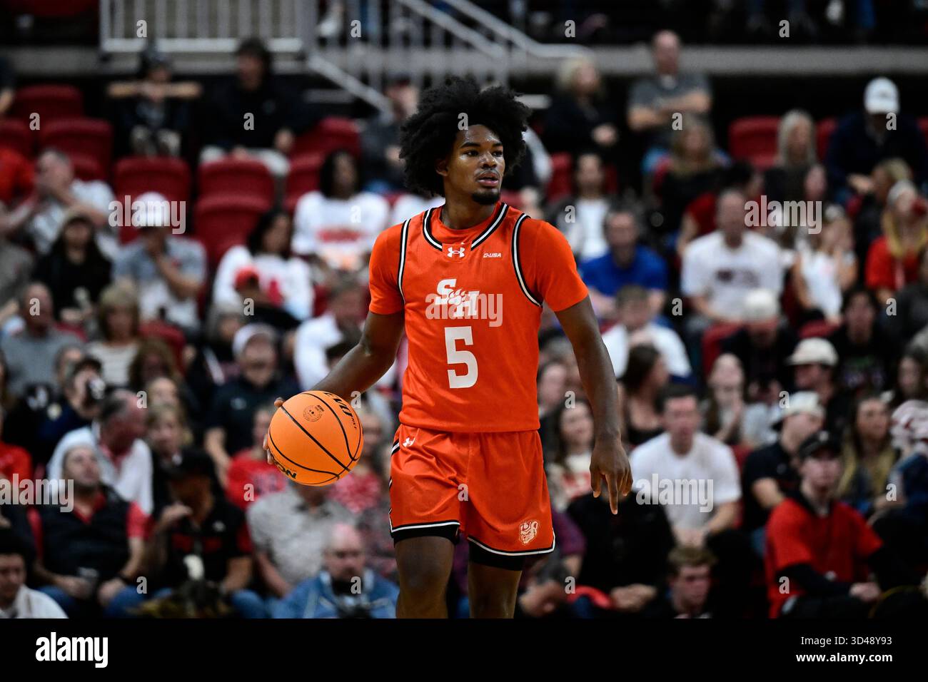 Sam Houston State guard Justin Begg (5) brings the ball up court ...
