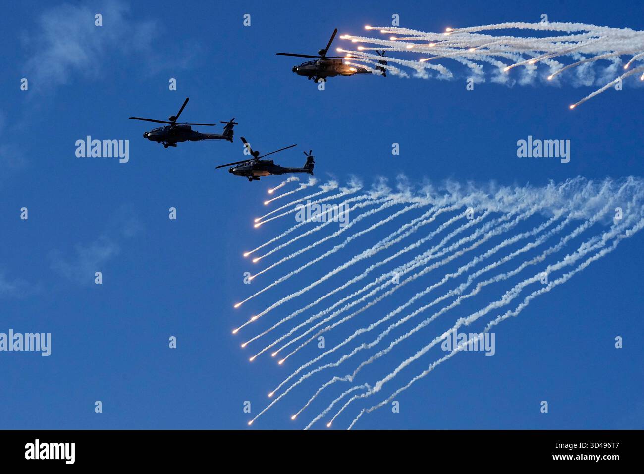 Indian Air Force AH-64 Apache helicopters perform in a formation during ...