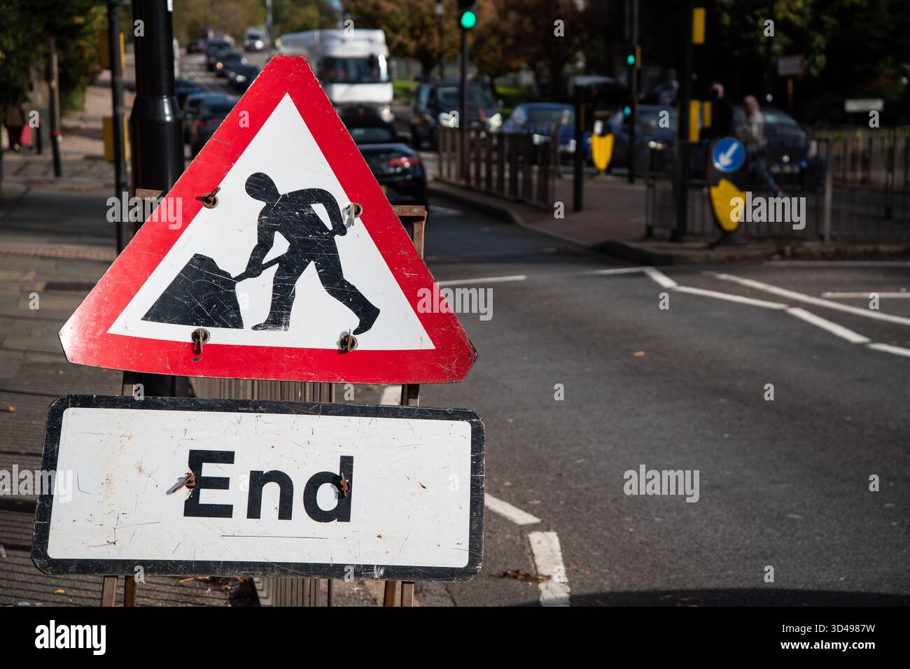 Triangle roadwork warning sign with “End” on a white sign, placed by ...
