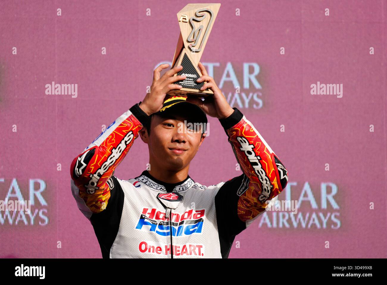 Japan's rider Taiyo Furusato poses on the podium after finishing third in the Moto3 race of the ...