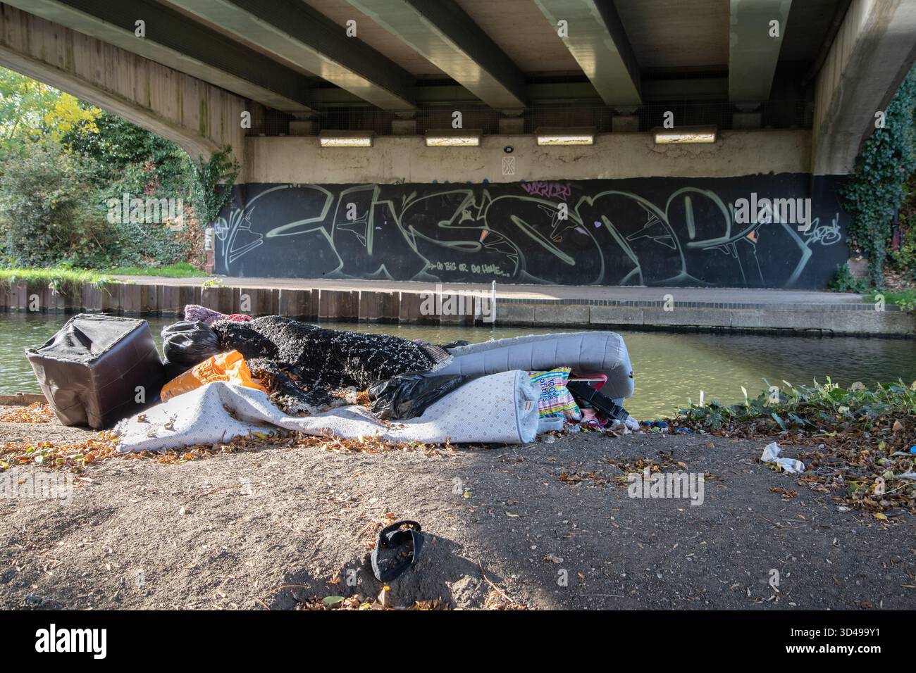 Dumped rubbish and furniture by the River Lea Navigation under the ...