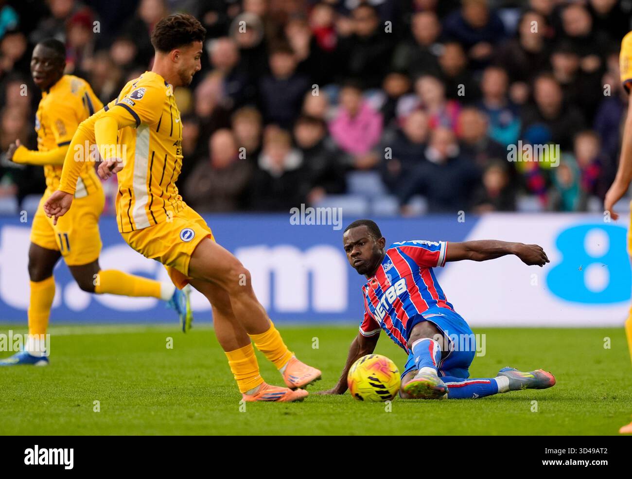Crystal Palace's Tyrick Mitchell takes the ball off Brighton and Hove ...