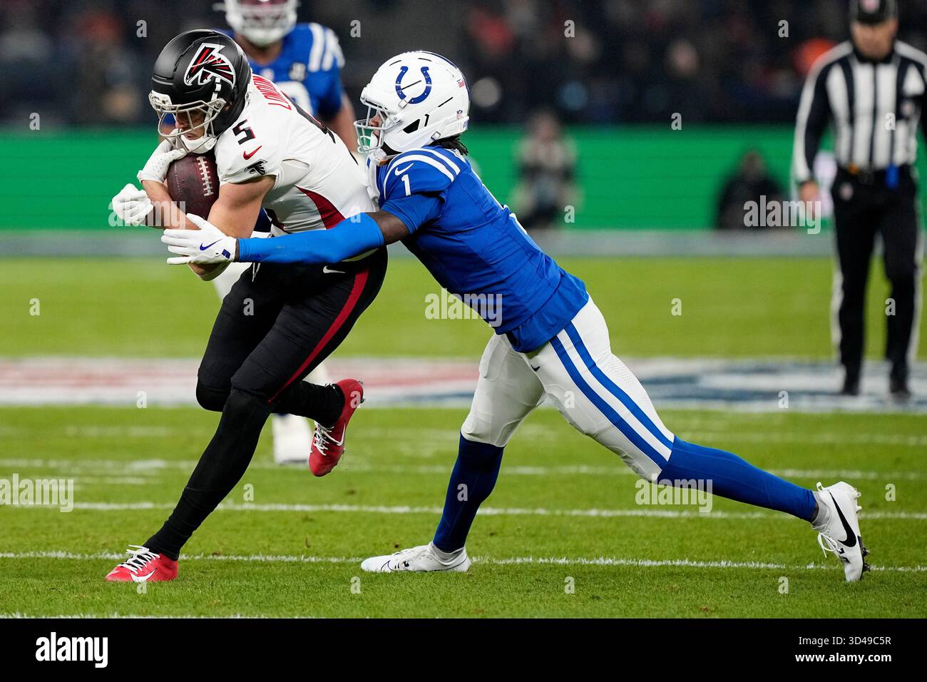 Atlanta Falcons wide receiver Drake London (5) is tackled by ...